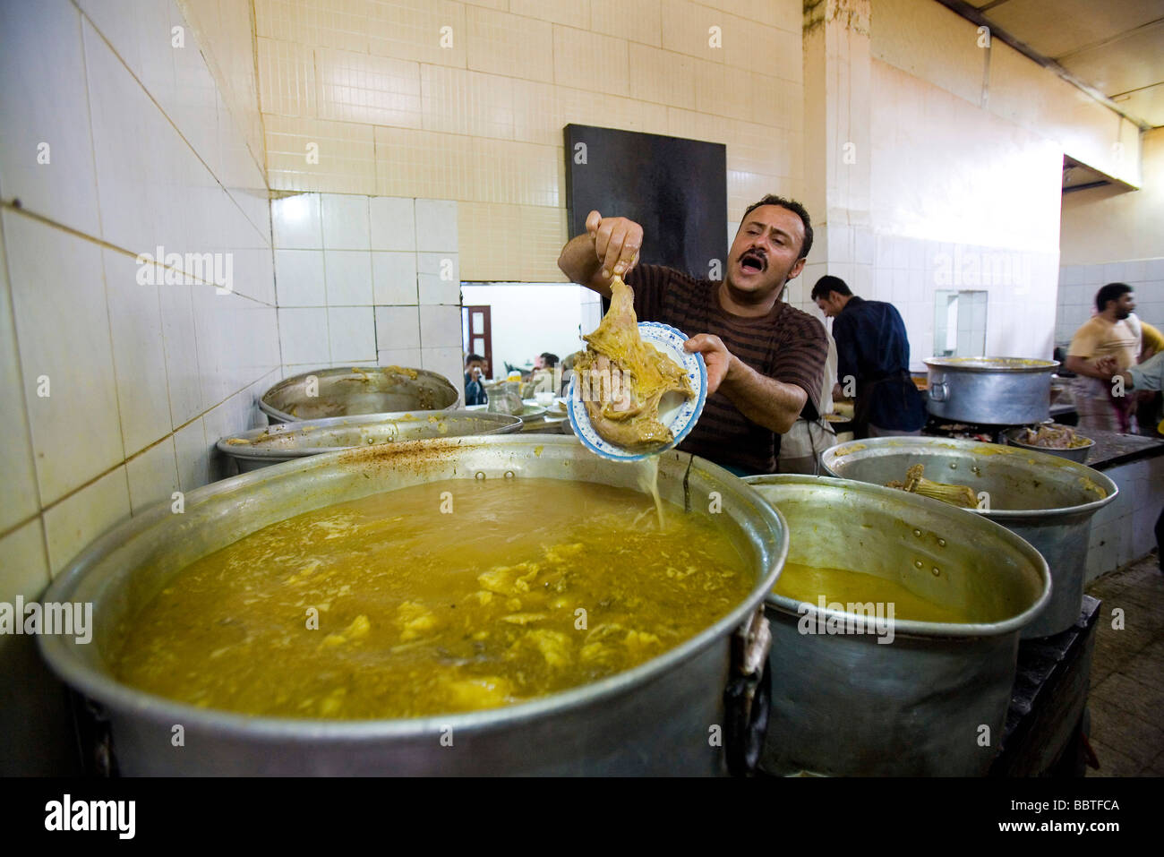 Preparation of chicken with spices, Yemenite restaurant, Sana'a, Yemen ...