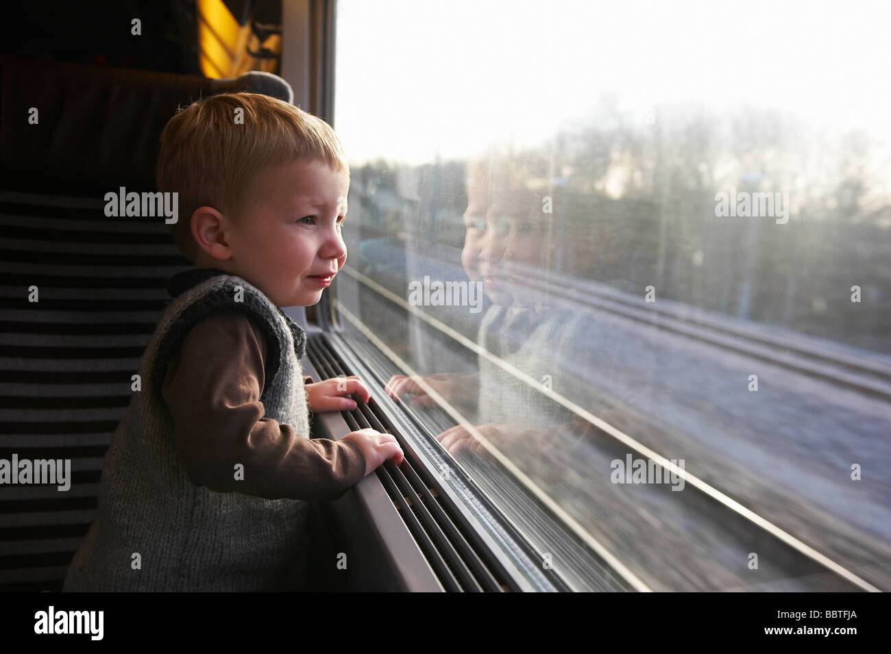 Child leaning out of train window hi-res stock photography and images ...