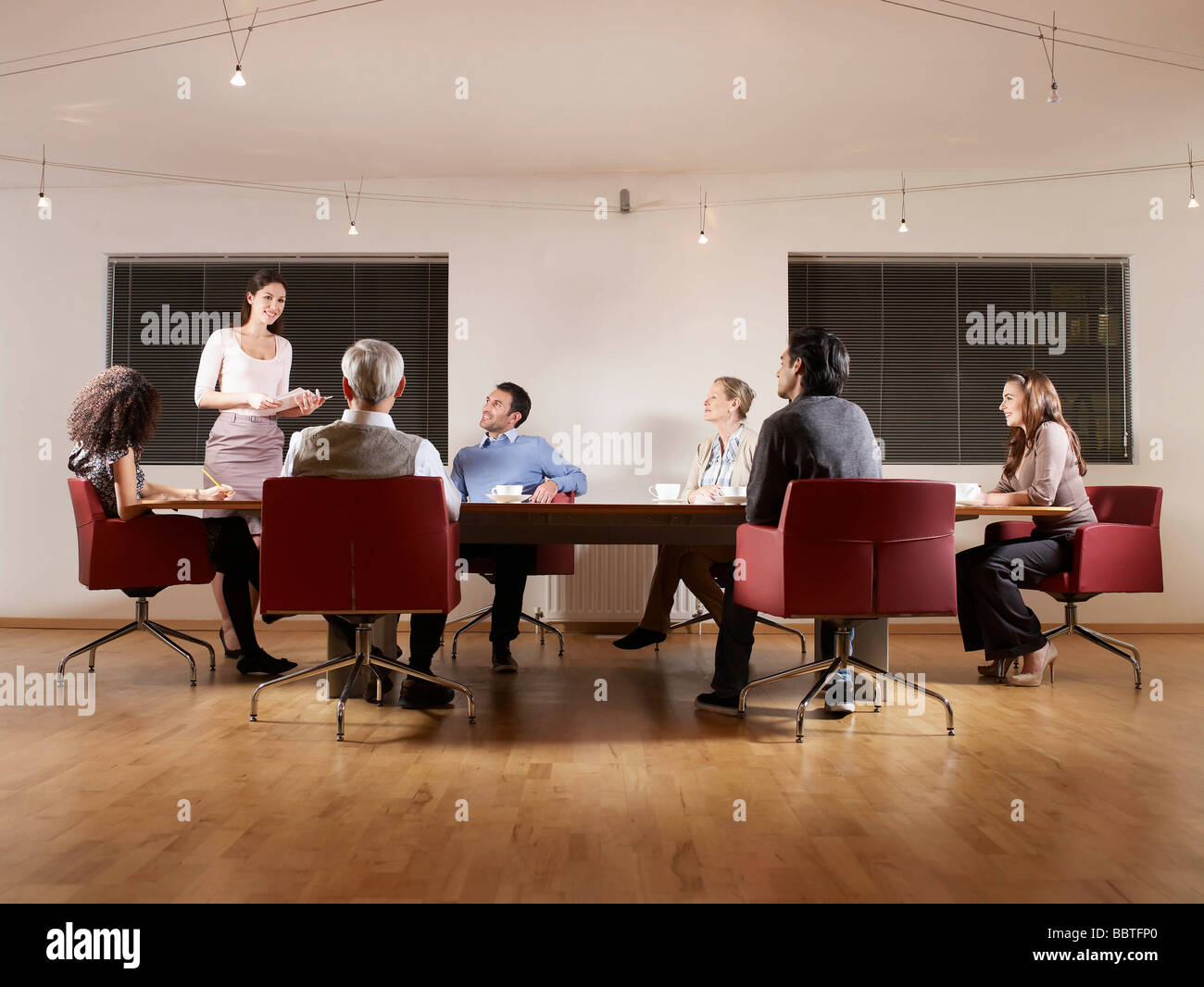 group of people at boardroom meeting Stock Photo - Alamy