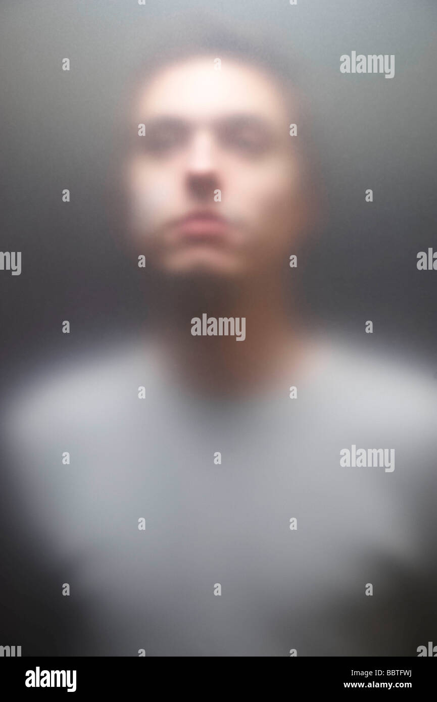 Young man behind frosted screen Stock Photo - Alamy