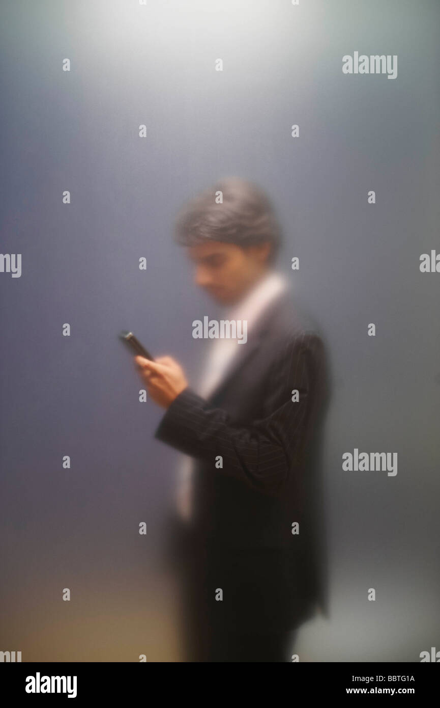 Man with phone behind frosted screen Stock Photo - Alamy