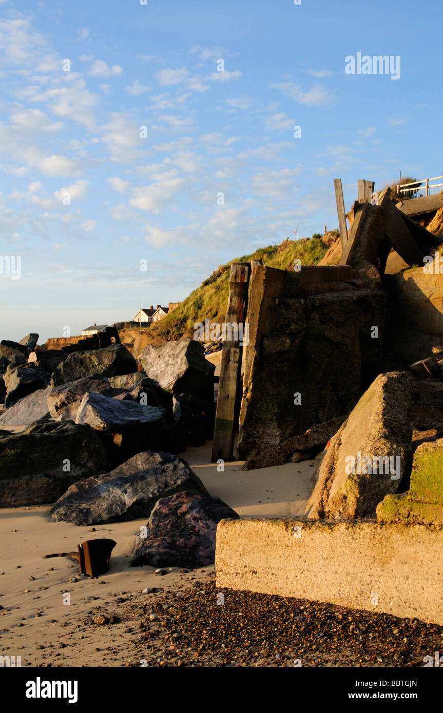Rubble at the base of the eroded cliffs at Happisburgh Norfolk England ...