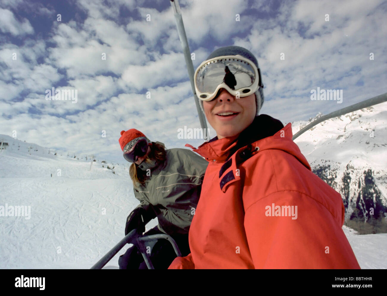 Couple riding on chair lift Stock Photo - Alamy
