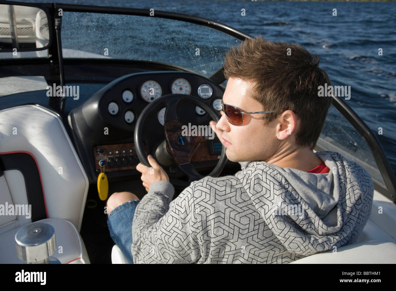 Man driving speed boat hi-res stock photography and images - Alamy