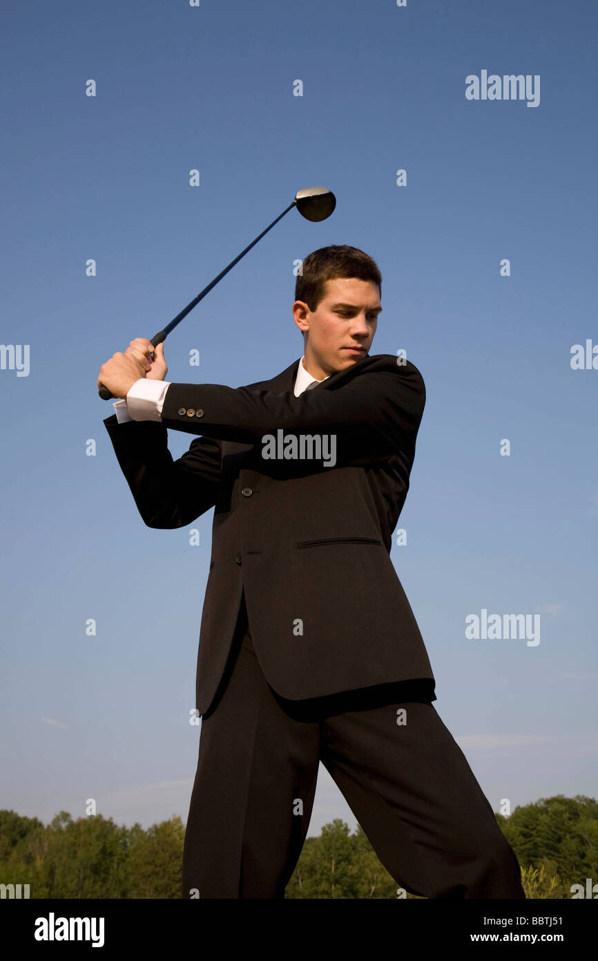 Business man playing golf Stock Photo - Alamy
