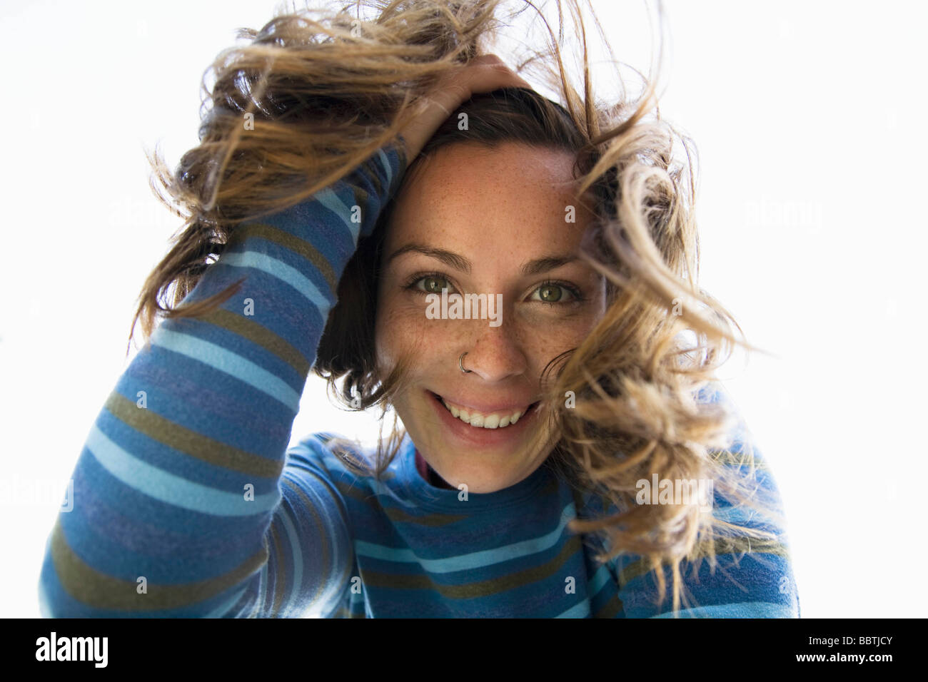 Woman smiling into camera Stock Photo - Alamy