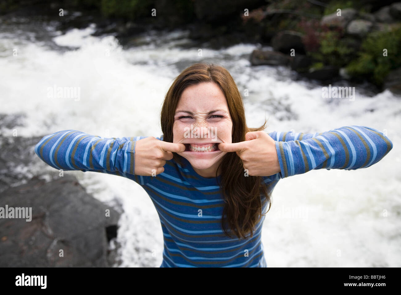 Woman making funny face Stock Photo - Alamy