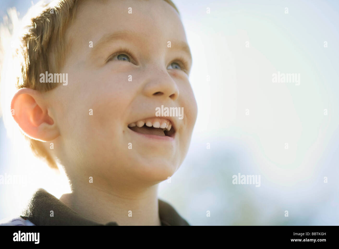 Young boy laughing Stock Photo - Alamy