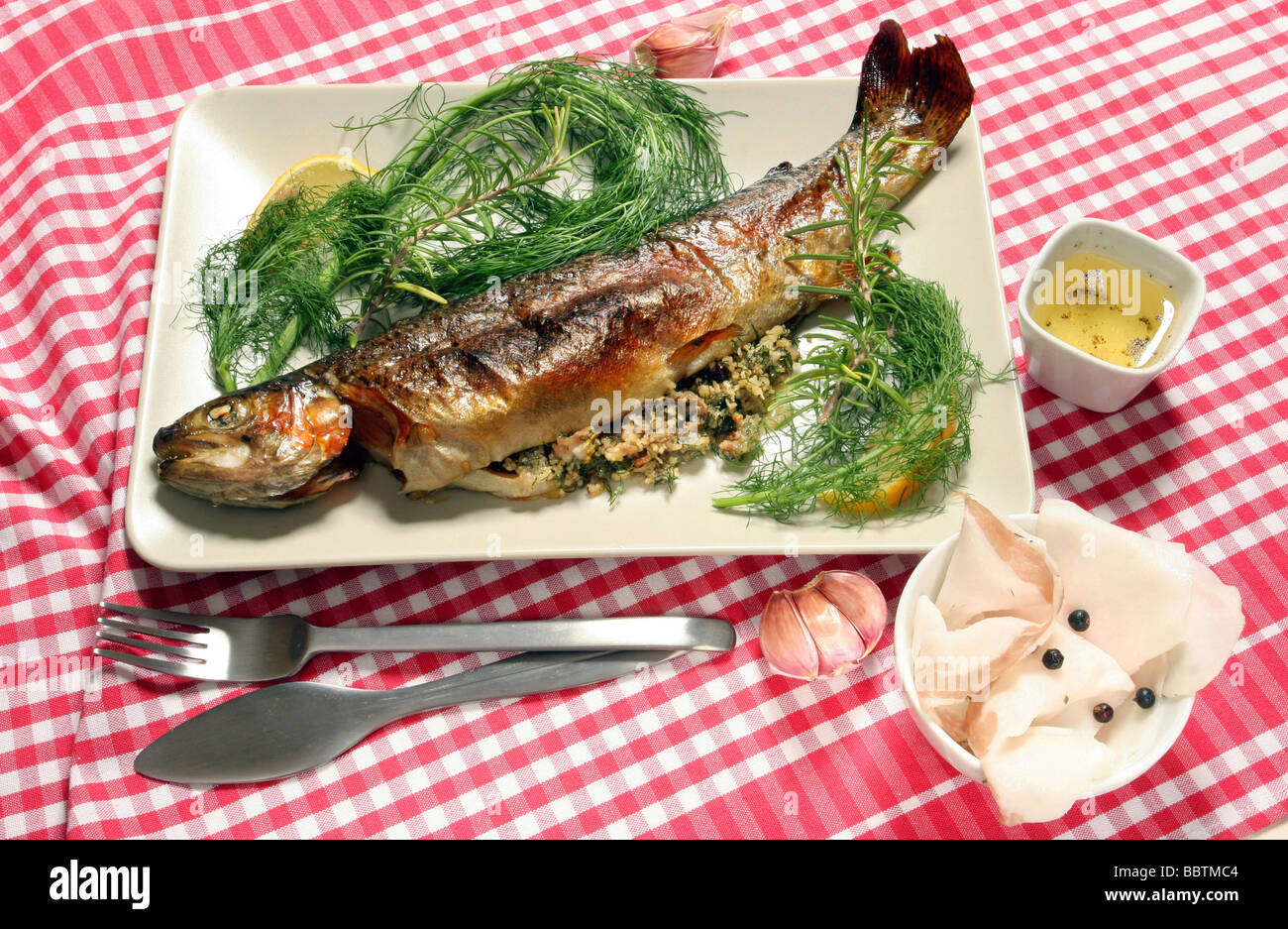 Salmon trout in whole roasted pig, Italy Stock Photo - Alamy