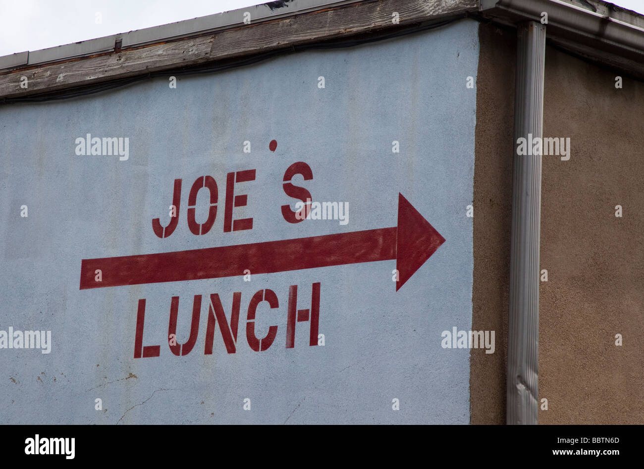Sign on the side of a building Stock Photo - Alamy