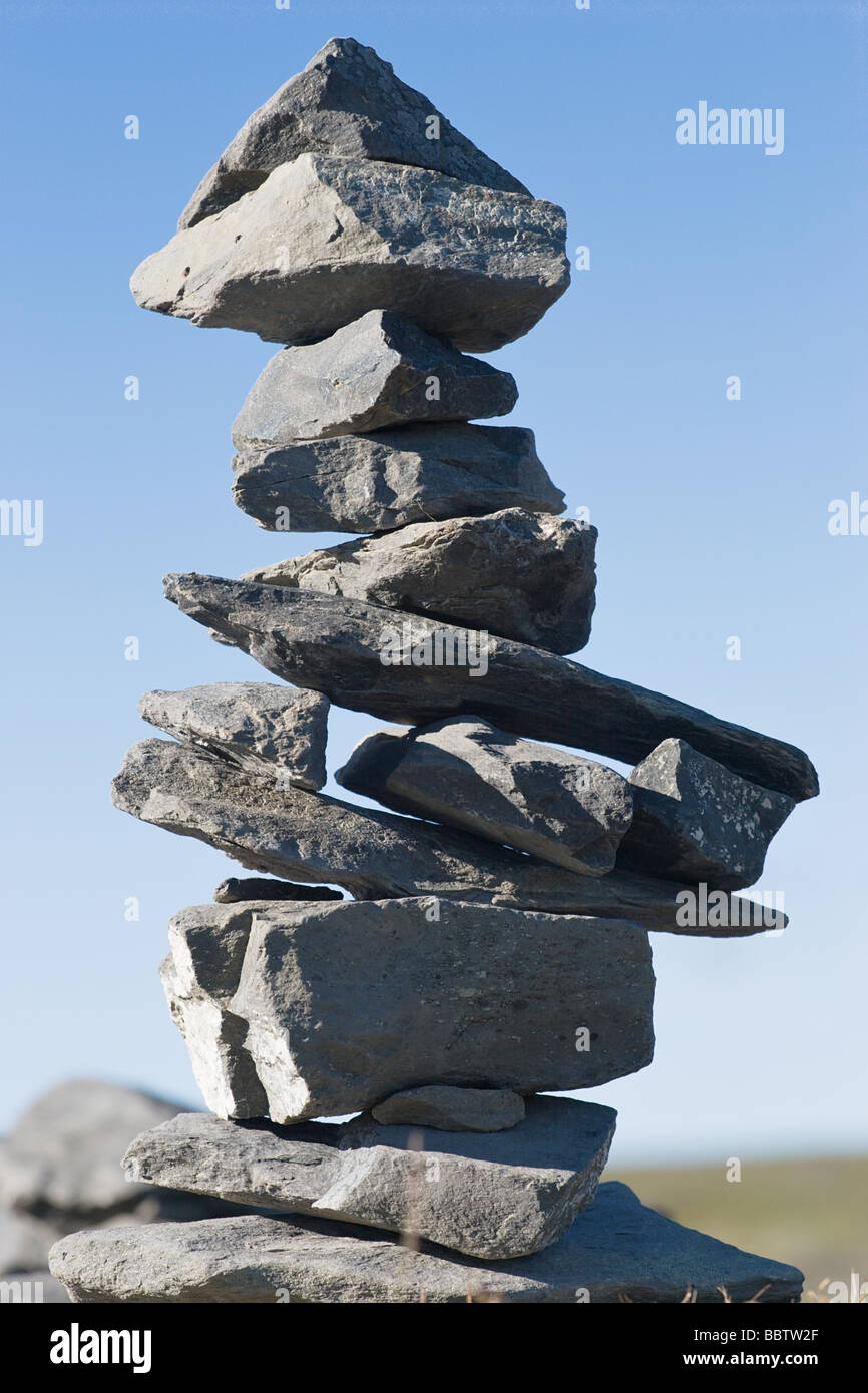 stones put on each other as pyramid on sky background Stock Photo - Alamy