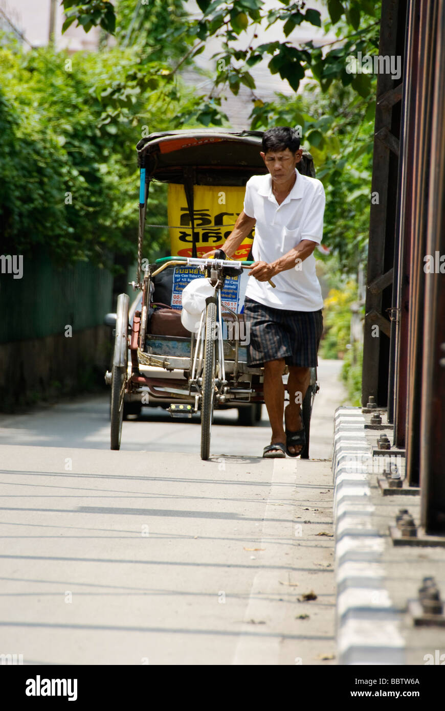 Tricycle taxi rider in Chiang Mai Thailand Stock Photo - Alamy