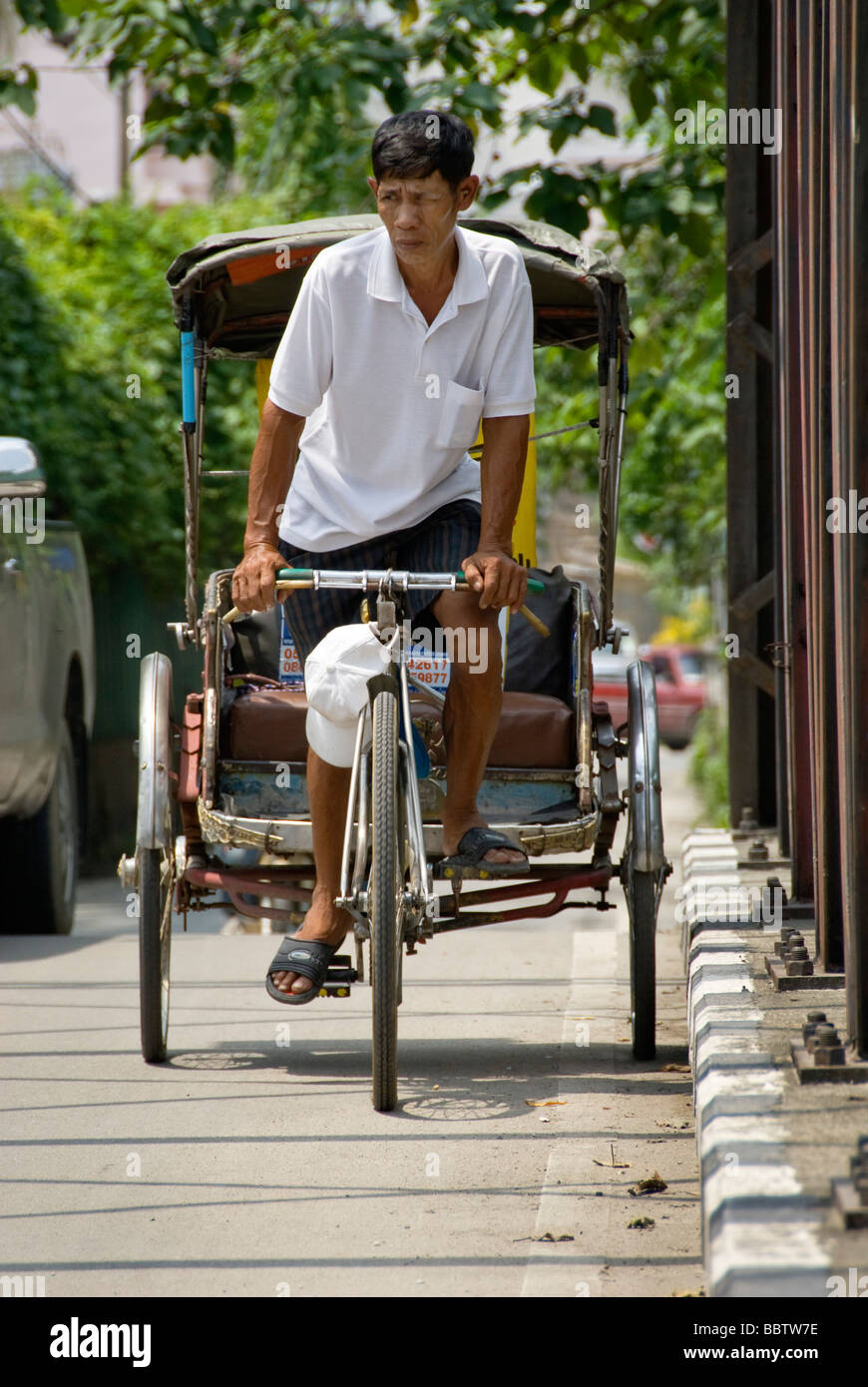 Tricycle taxi rider in Chiang Mai Thailand Stock Photo - Alamy