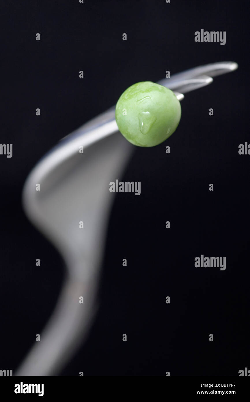Fresh Pea on a fork Stock Photo - Alamy