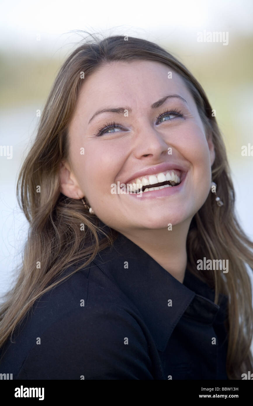 Attractive young woman laughing out loud Stock Photo - Alamy Attractive young woman laughing out loud Stock Photo - Alamy