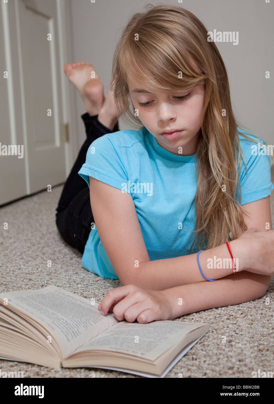 Child reading a book Stock Photo - Alamy