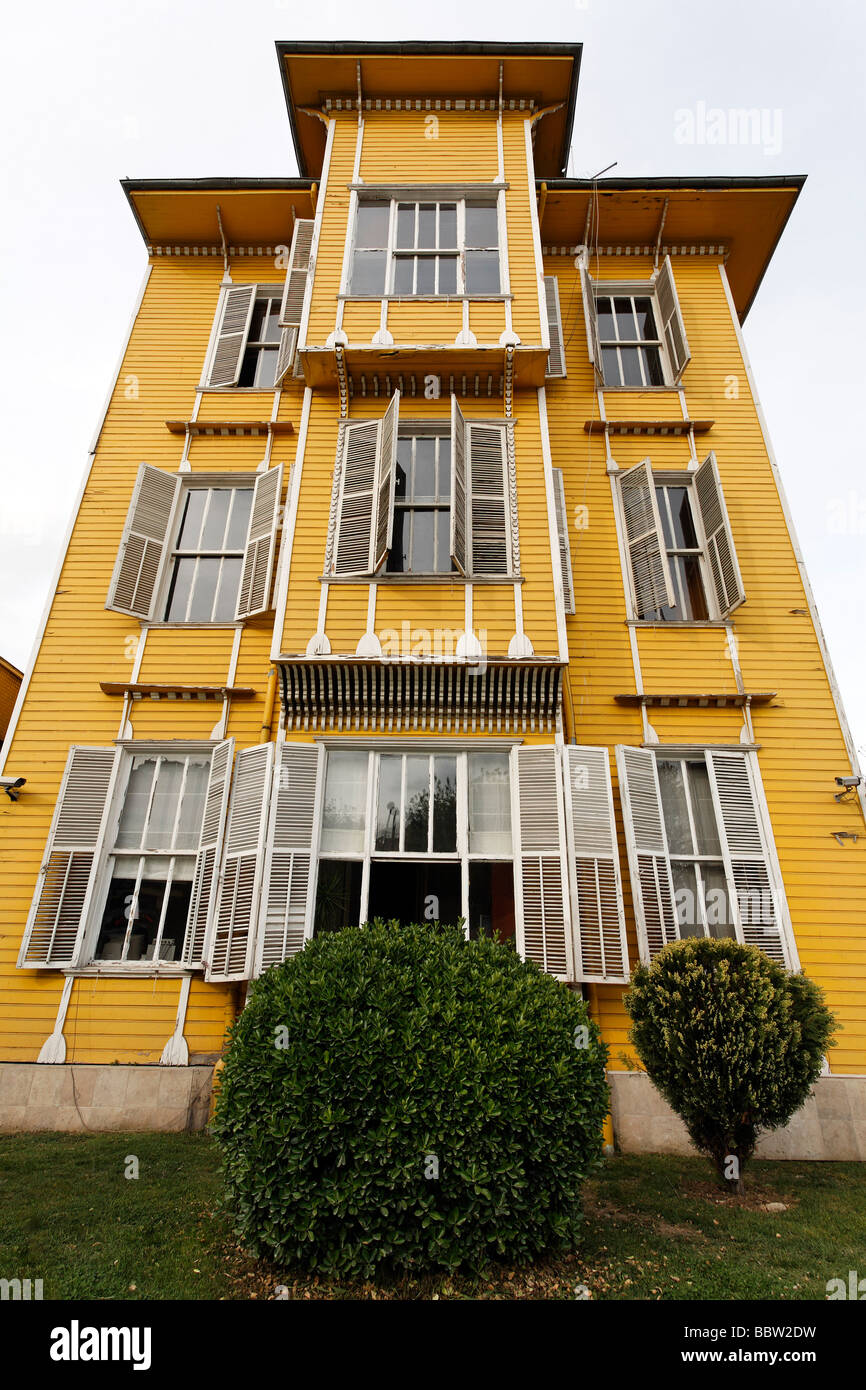 Traditional Ottoman wooden house with bay windows, painted yellow ...