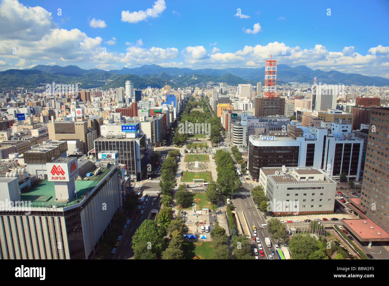 Skyscrapers in Urban city with cloudy sky Stock Photo - Alamy
