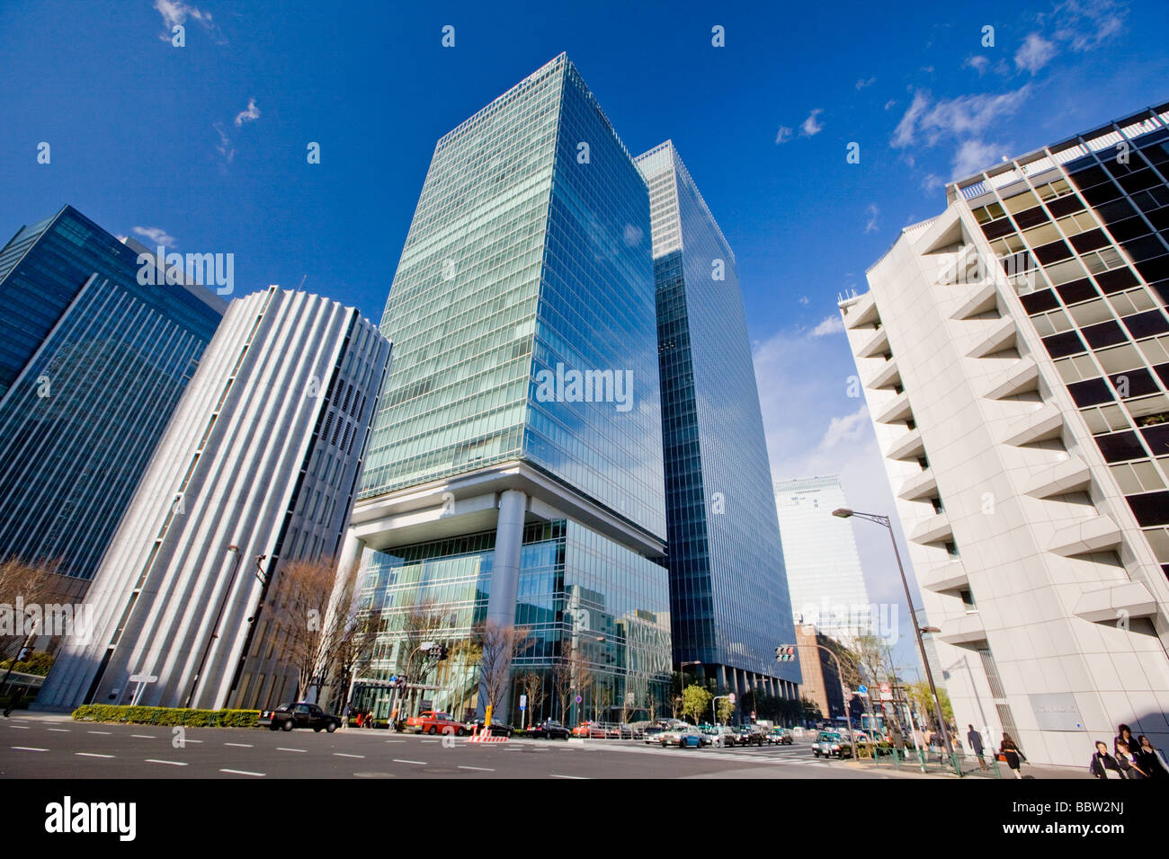 Roadside buildings against blue sky Stock Photo - Alamy
