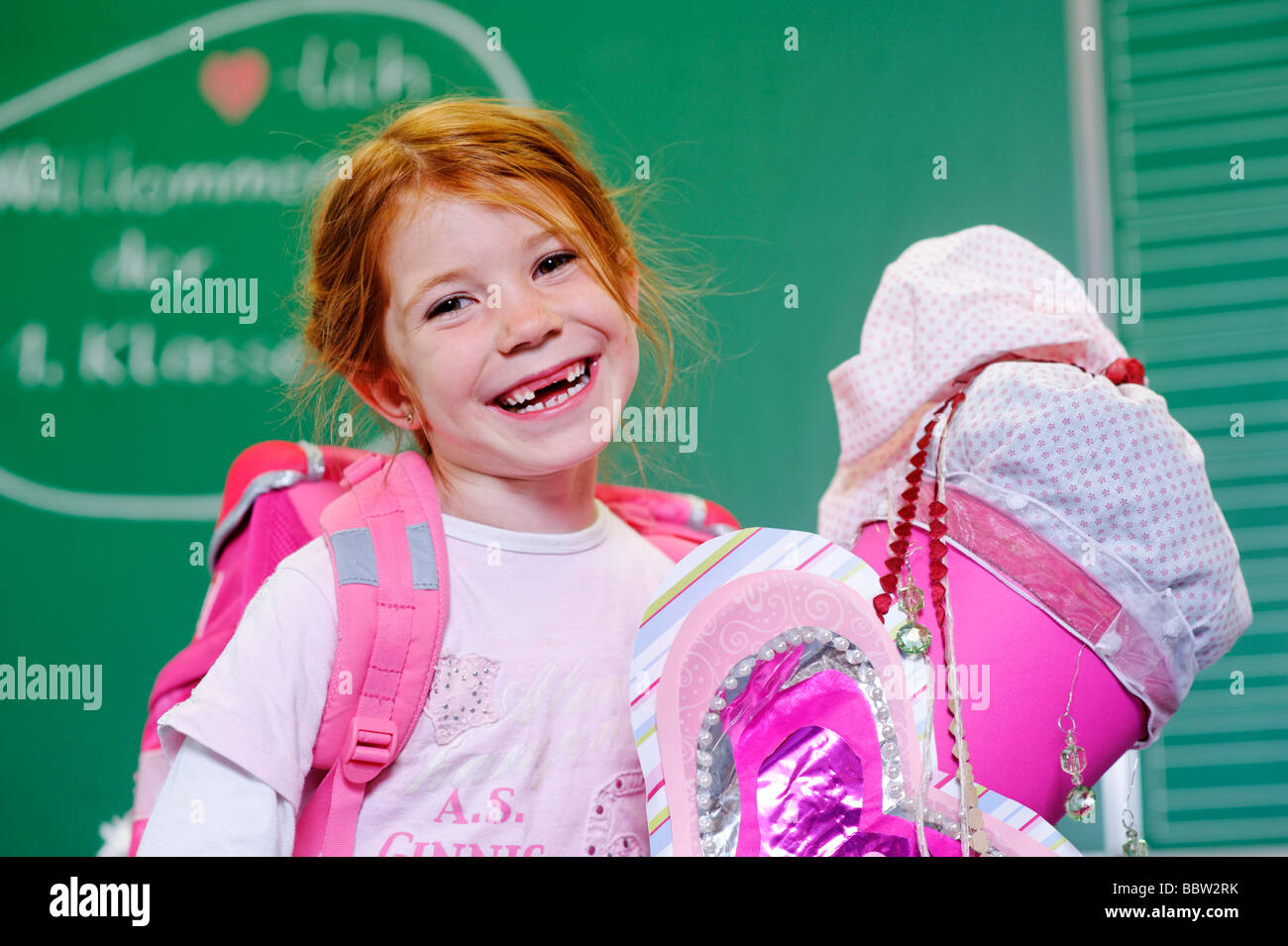Girl on her first day at school holding a schultuete, school cone ...