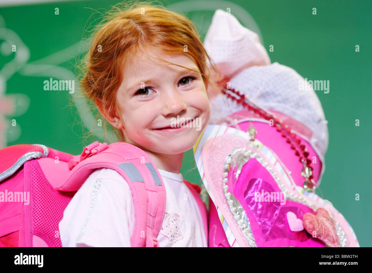 Girl on her first day at school holding a schultuete, school cone ...