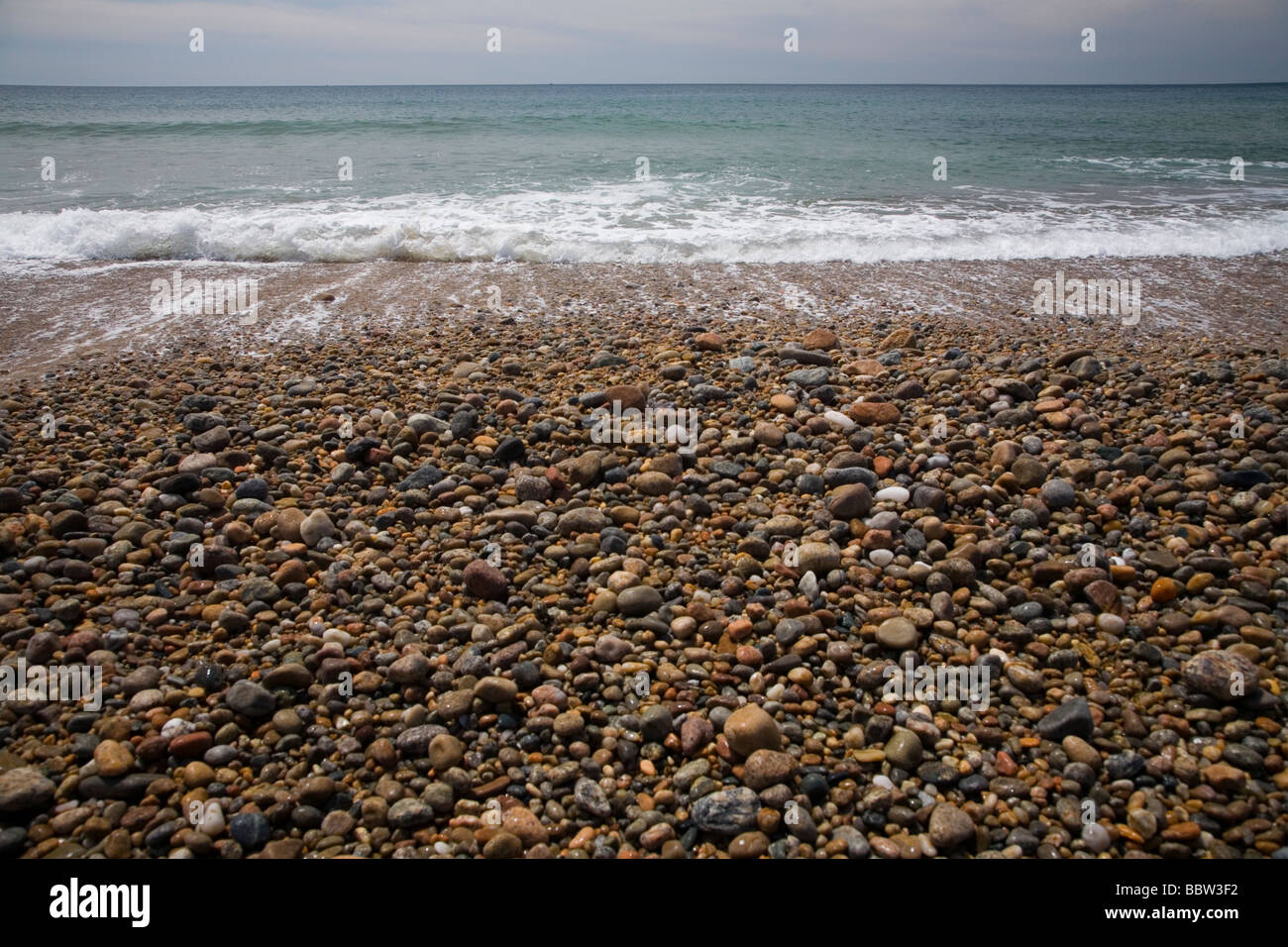Beach photograph of wet sand and the ocean tide Stock Photo - Alamy