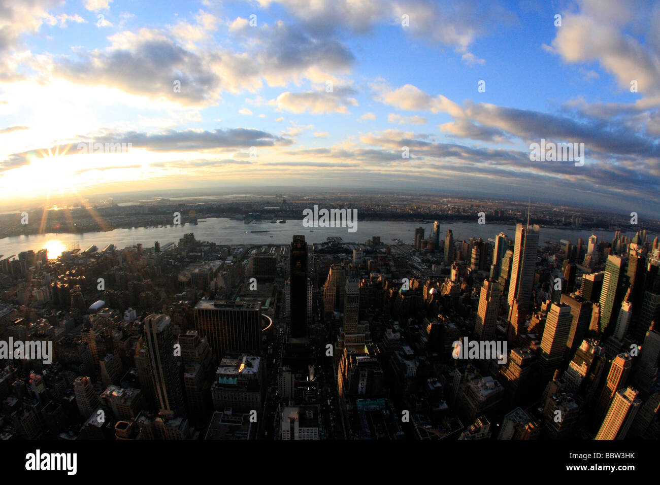 A night time view of building tops in New York City, from midtown area ...