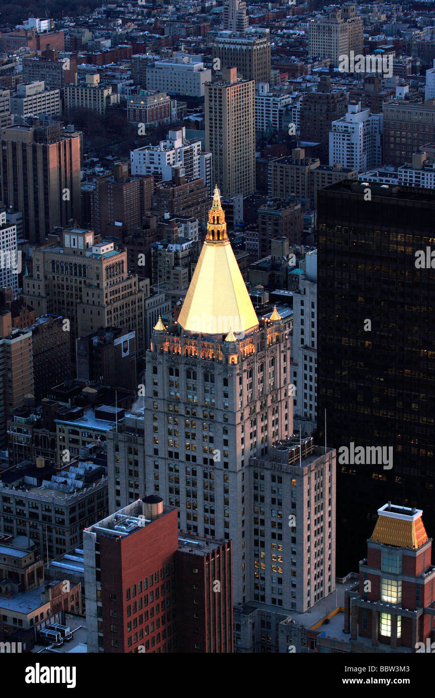 A night time view of building tops in New York City, from midtown area ...