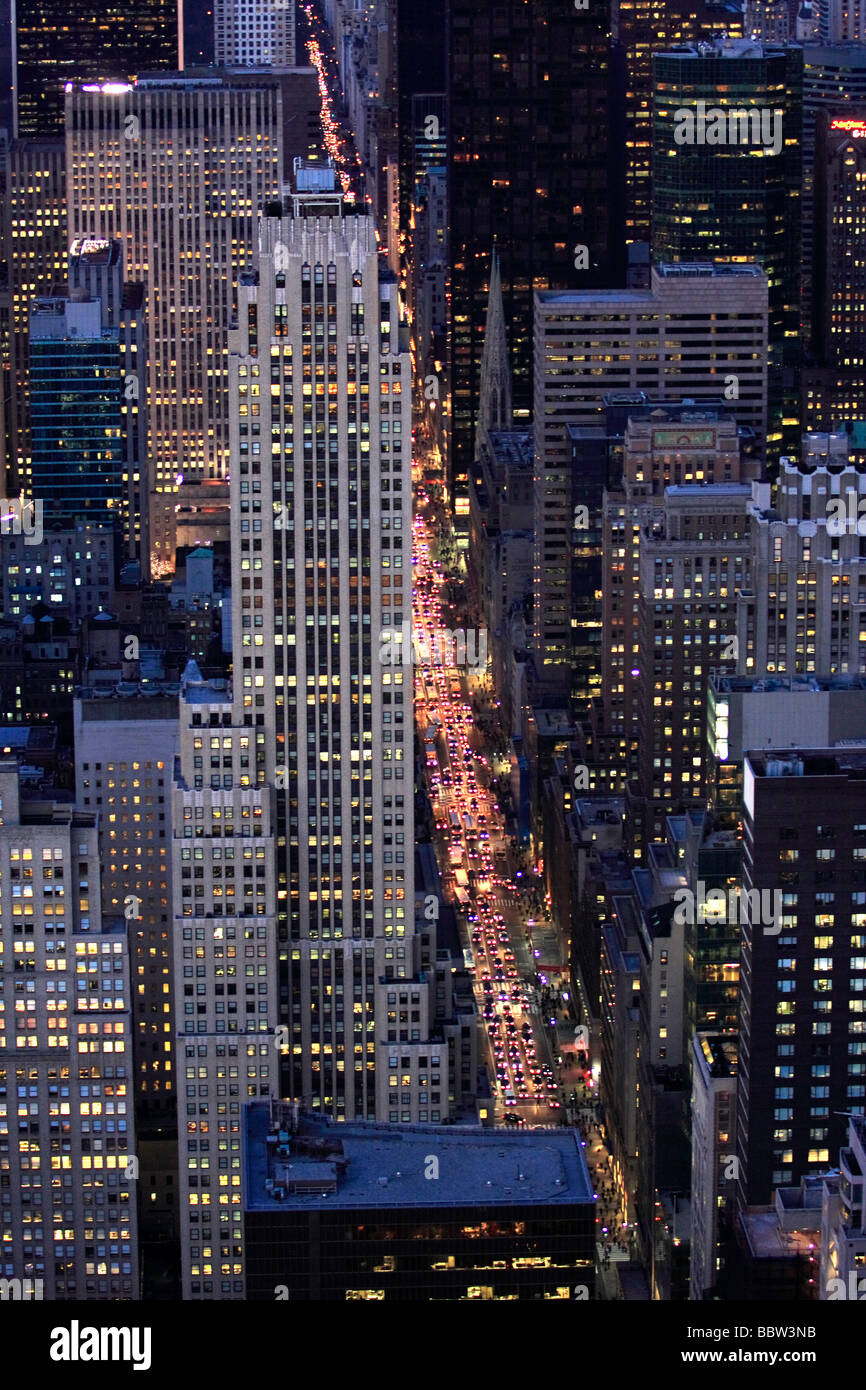 A night time view of building tops in New York City, from midtown area ...