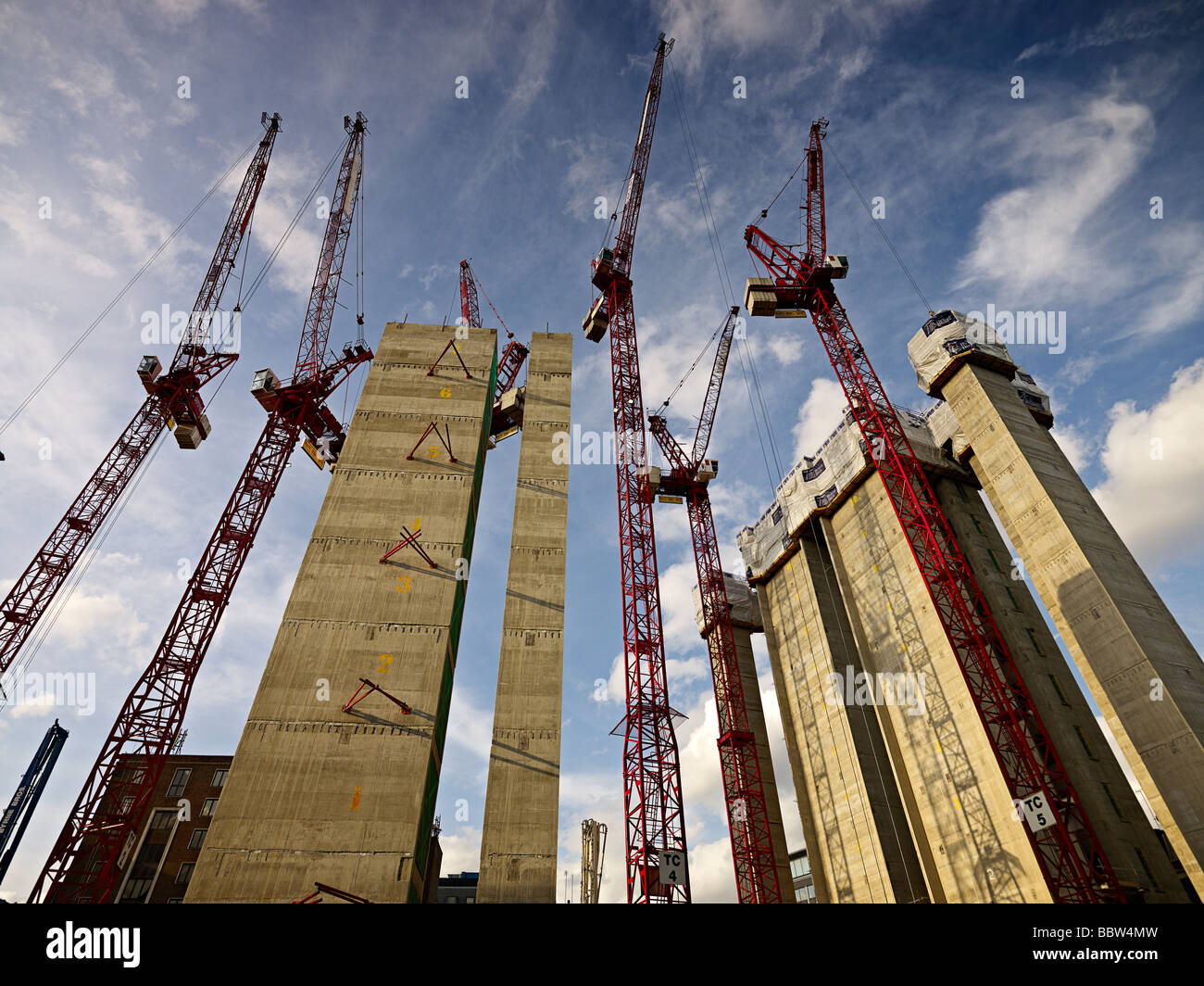 Construction of a new building with red cranes in Central London ...