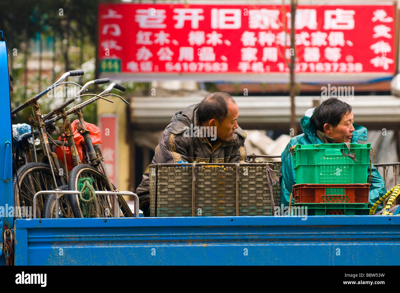chinese workers on a truck in the way to work Stock Photo - Alamy