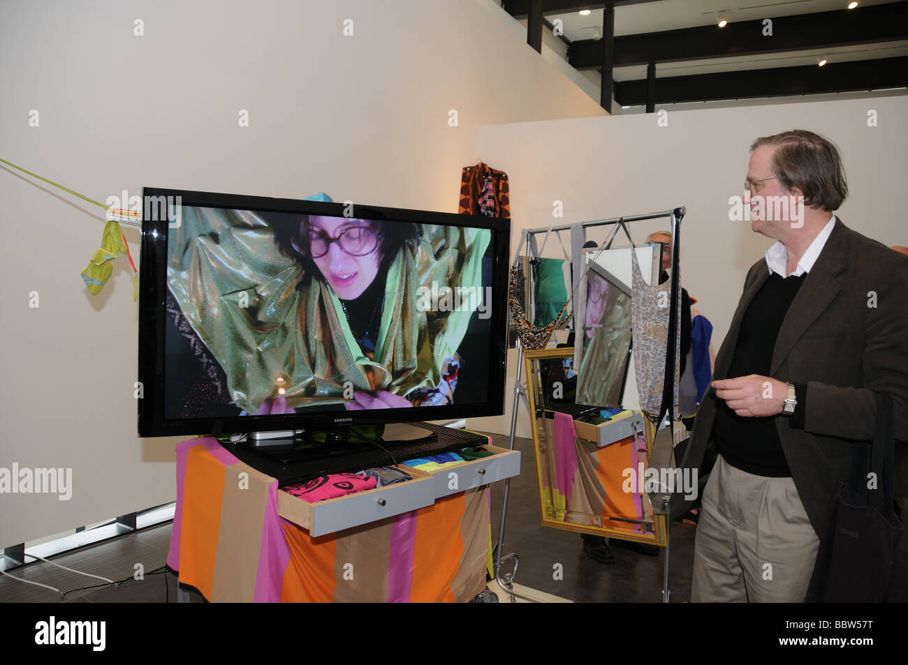 Robert Storr, dean of the Yale University School of Art, looking at art ...