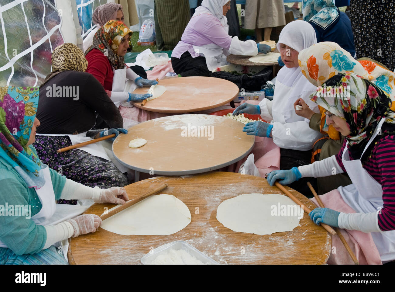 COUPLE OF TURKISH ELDERLY WOMAN MAKING PASTRY DURING THE TURKISH ...