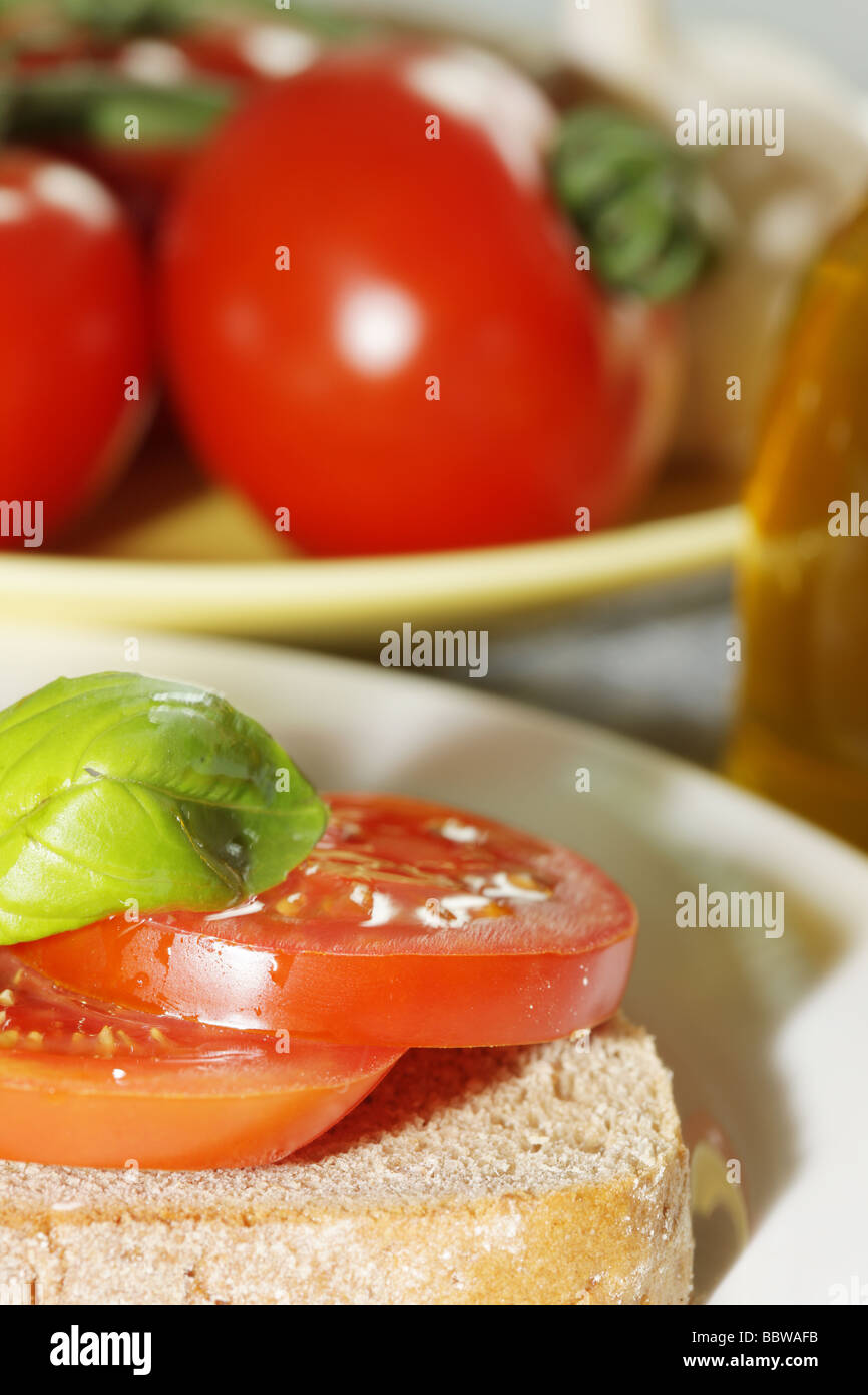 Sliced Tomato with Basil on Sourdough Bread Stock Photo - Alamy