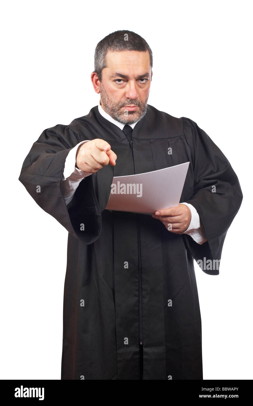 Serious male judge reading the sentence isolated on white background ...