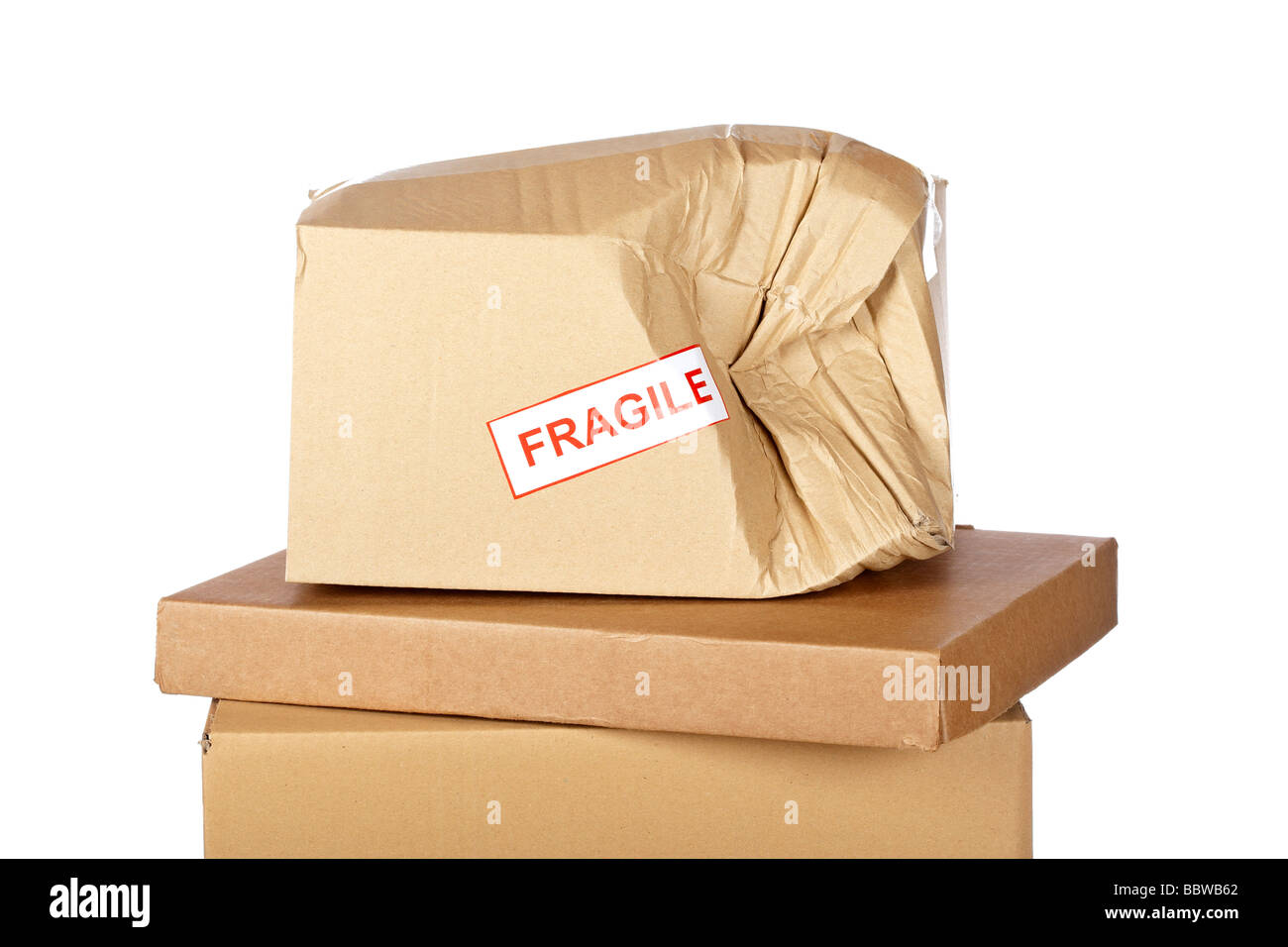 Damaged cardboard box isolated on white background Stock Photo - Alamy