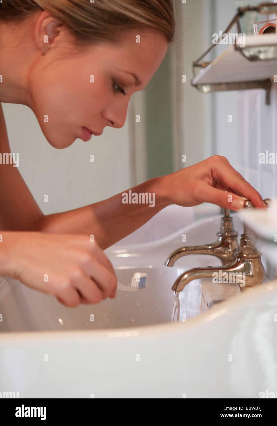 young woman washing teeth Stock Photo - Alamy