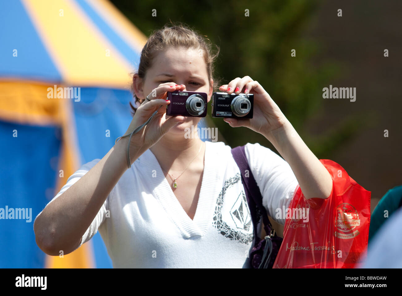 A tourist uses two digital cameras to take photographs Stock Photo - Alamy