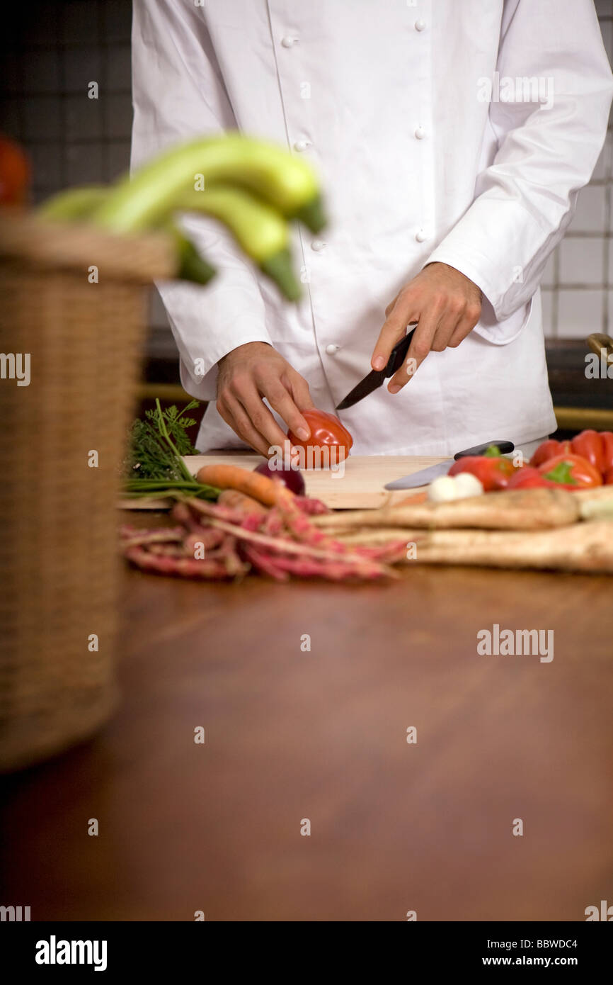 chef cutting tomato Stock Photo - Alamy