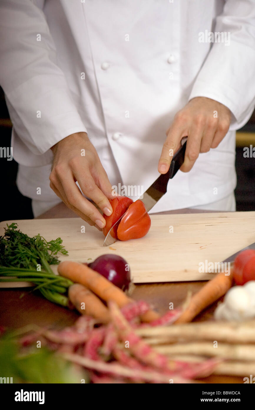 chef cutting tomato Stock Photo - Alamy
