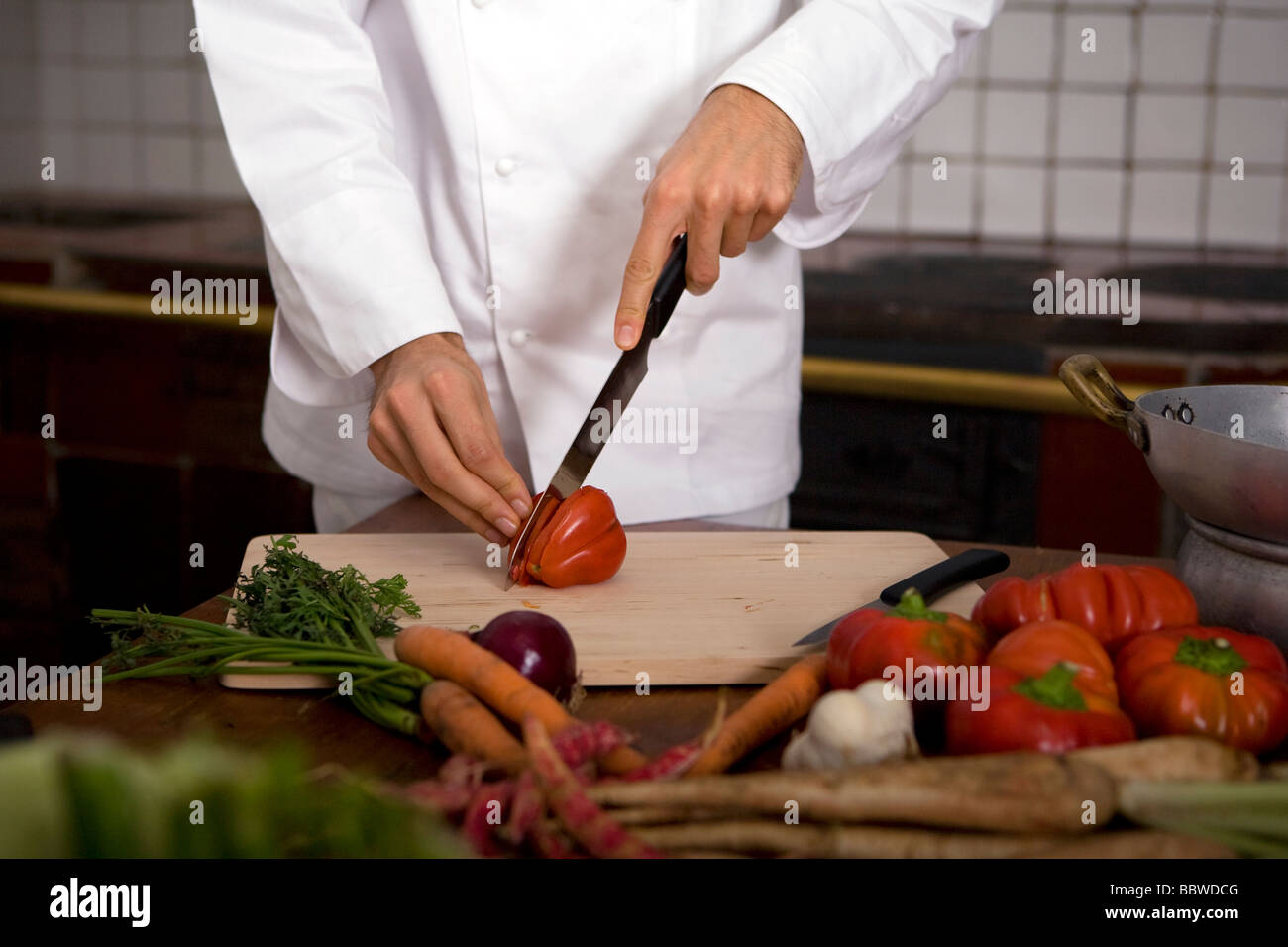chef cutting tomato Stock Photo - Alamy