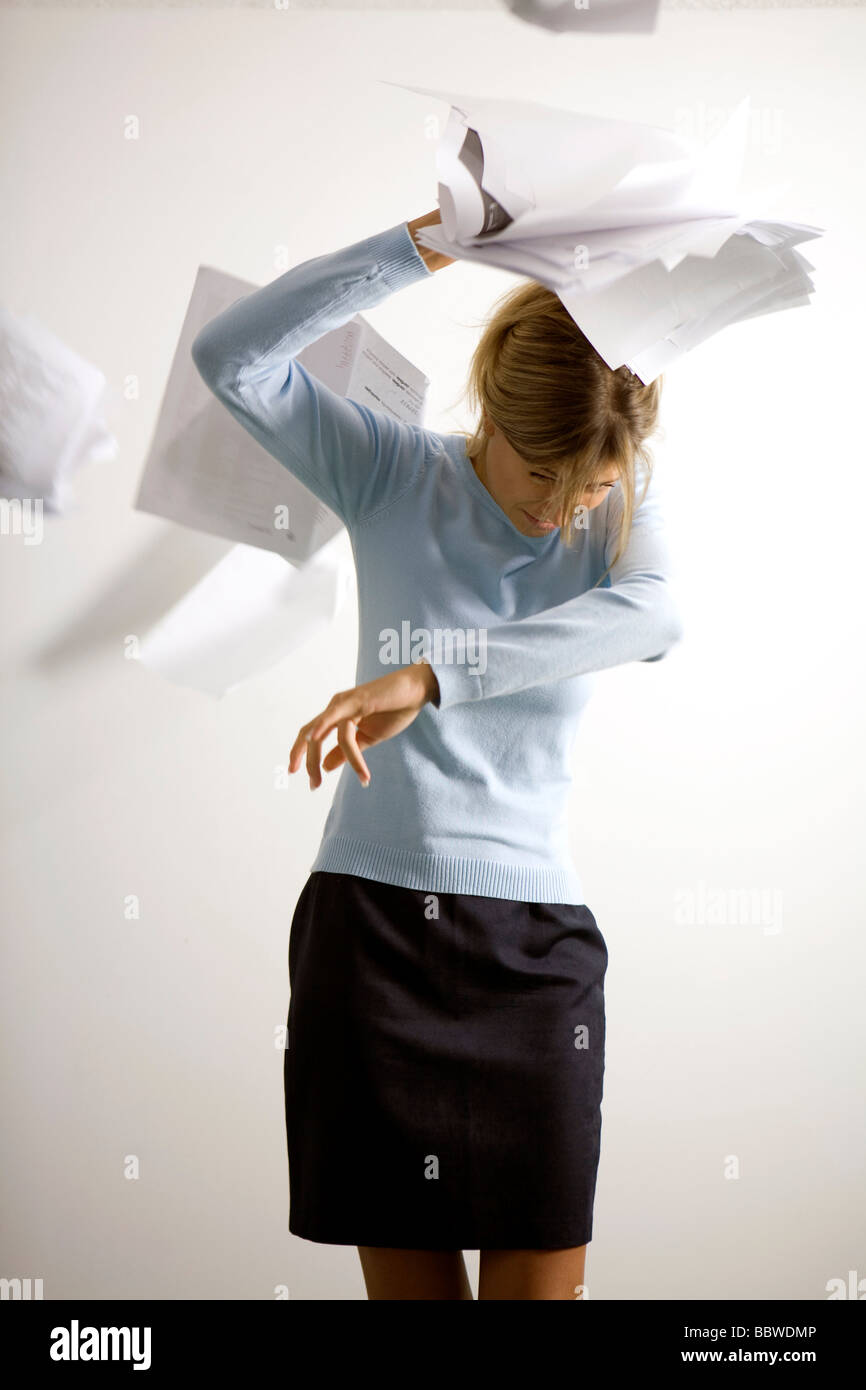 woman and sheets of paper, stress Stock Photo - Alamy