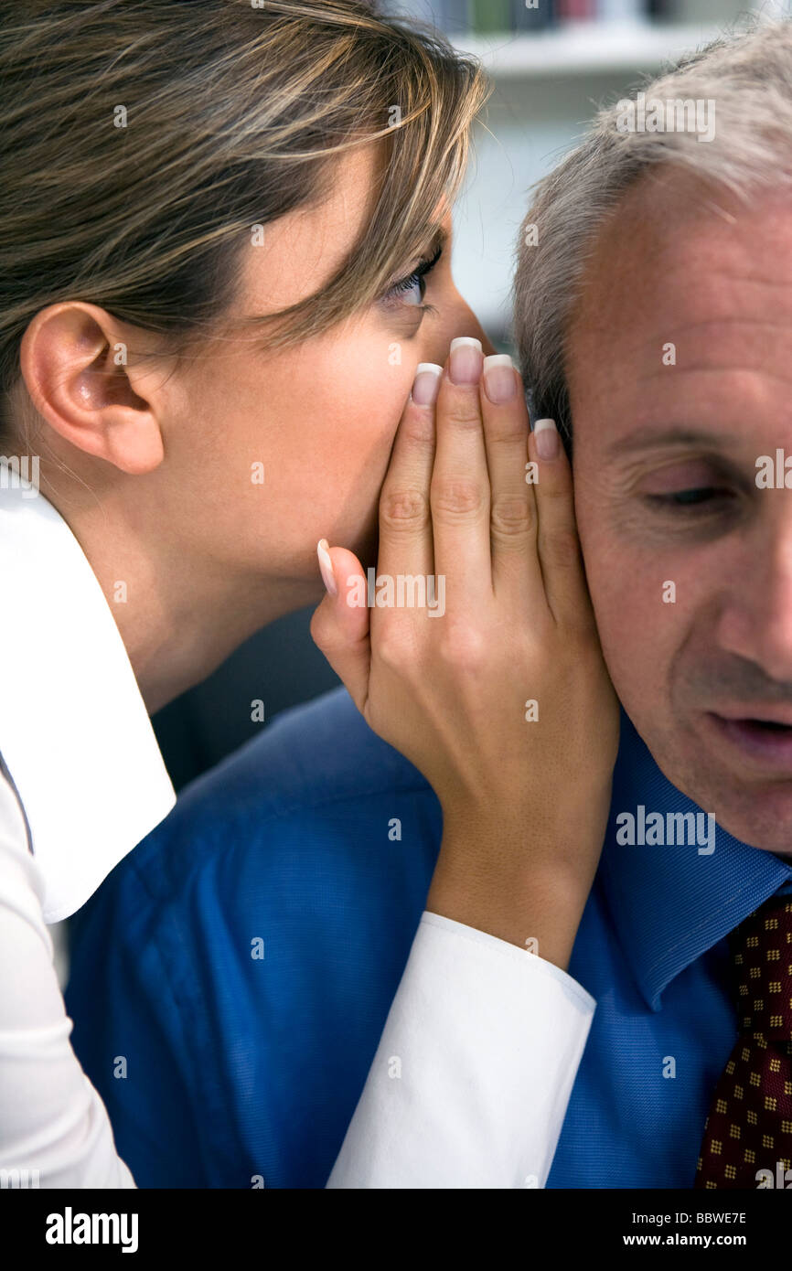 Ear whisper men suit hi-res stock photography and images - Alamy