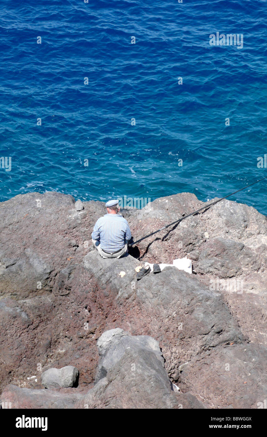 Fisherman on rocks hi-res stock photography and images - Alamy