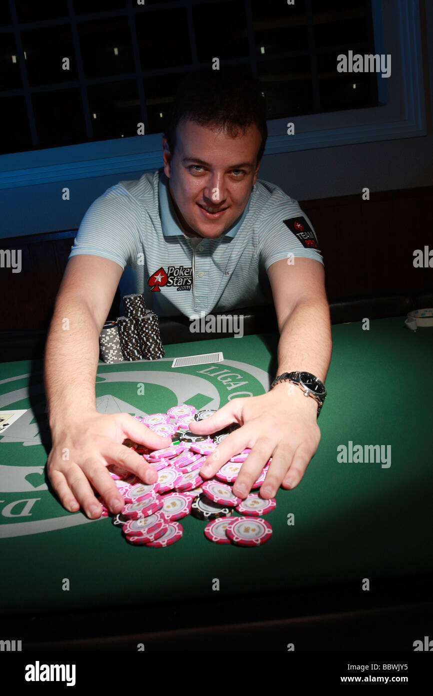 Man playing pooker Stock Photo - Alamy