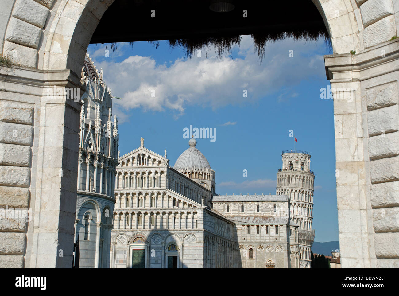 Cathedral and leaning tower of pisa, seen through entrance arch to the ...