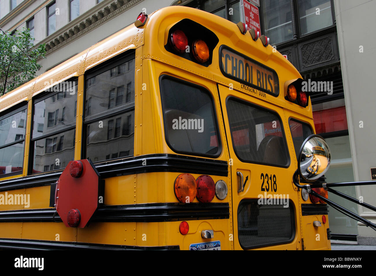 Rear section American yellow childrens school bus Stock Photo - Alamy