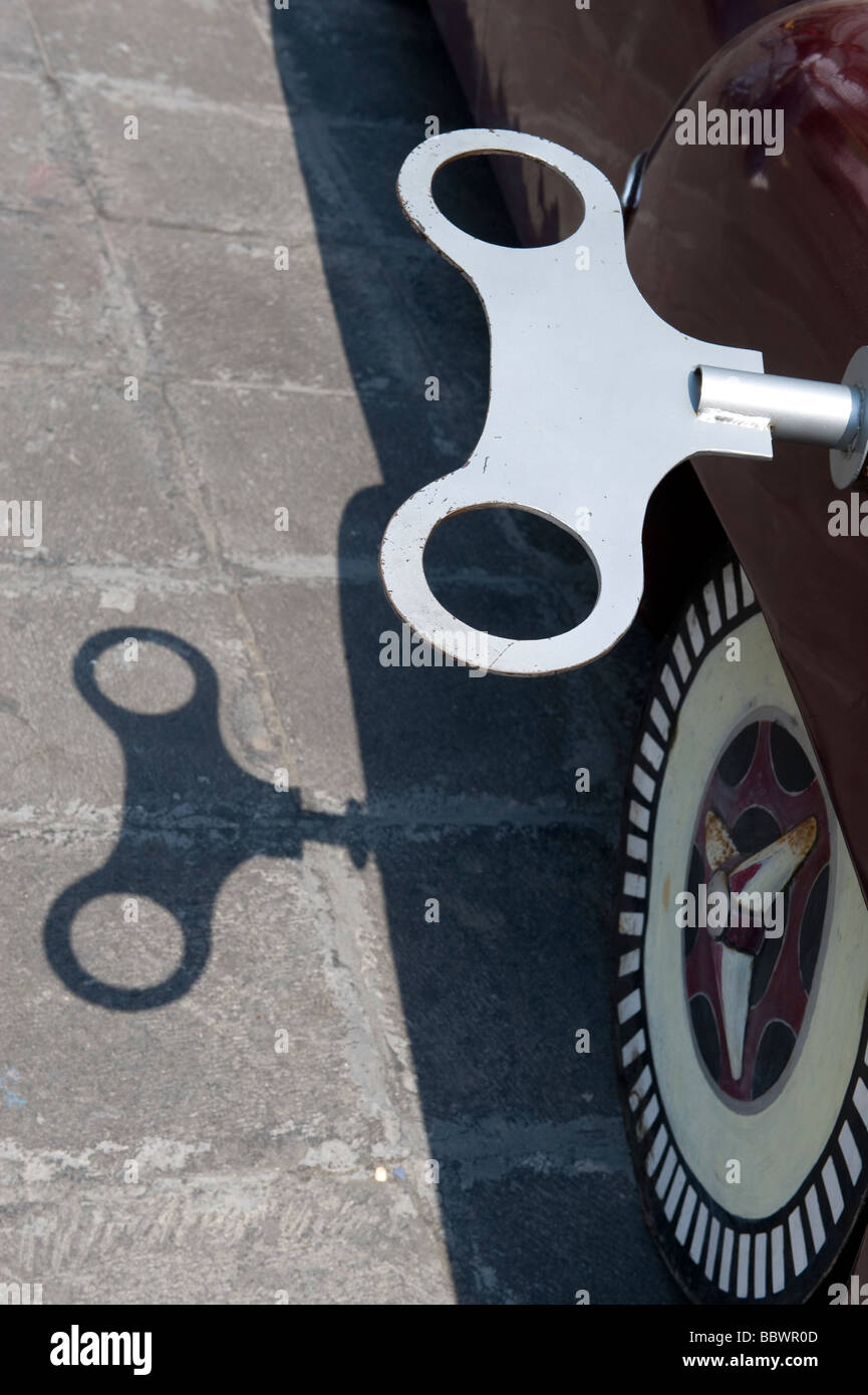 Large key to wind up a "green" clockwork eco-car connection by linking ...