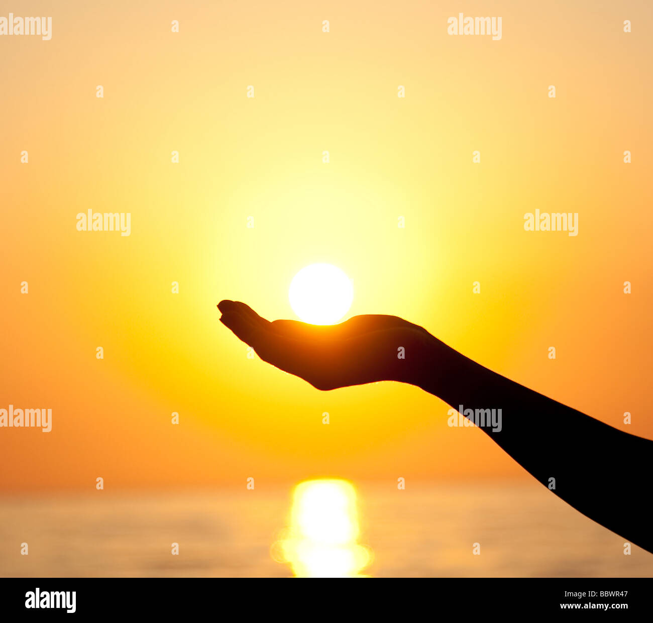 Girl holding the sun Stock Photo - Alamy