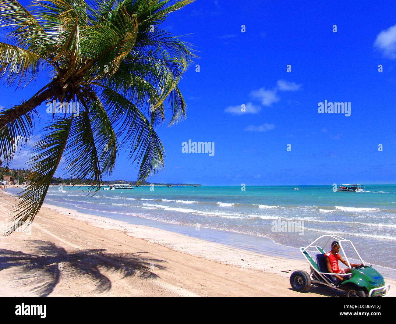 a person driving a buggy car at alagoas beach brazil Stock Photo - Alamy